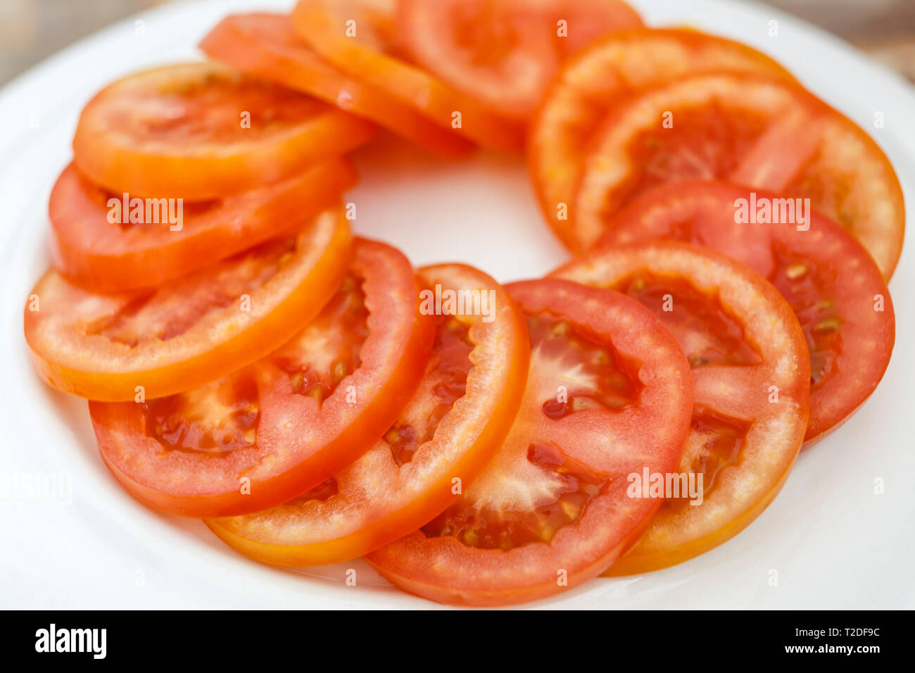 Slice of tomatoes hi-res stock photography and images - Alamy