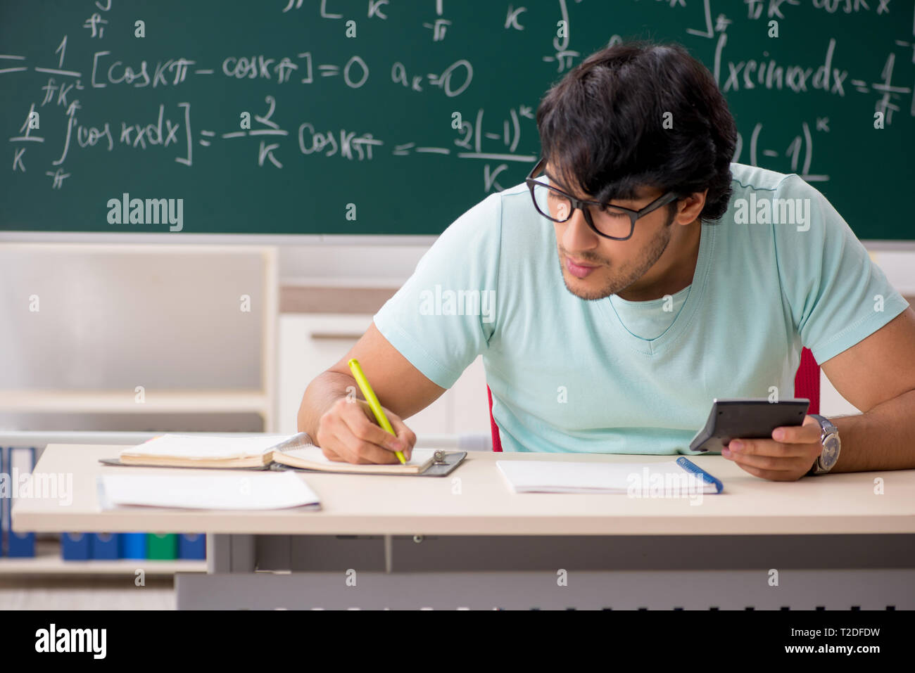 Student with calculator taking test hi-res stock photography and images ...