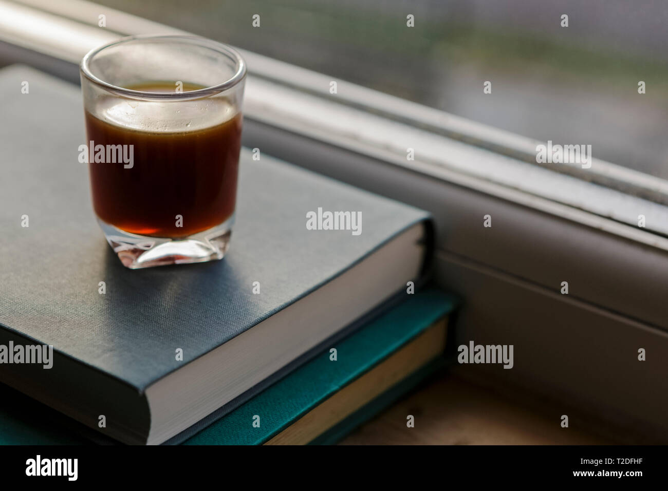 Books window sill hi-res stock photography and images - Alamy