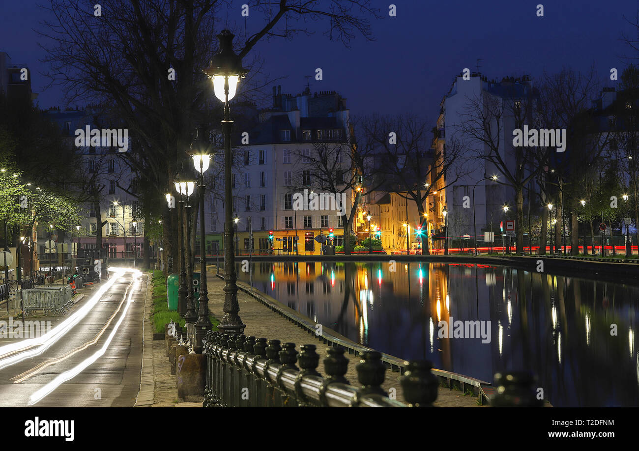 The houses near Canal Saint-Martin at night .It is long canal ...