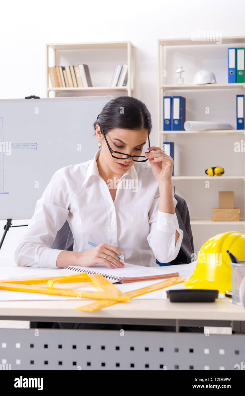 Female architect working in the office Stock Photo - Alamy