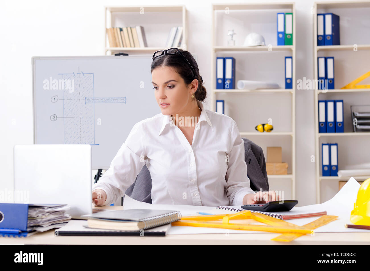 Female architect working in the office Stock Photo - Alamy