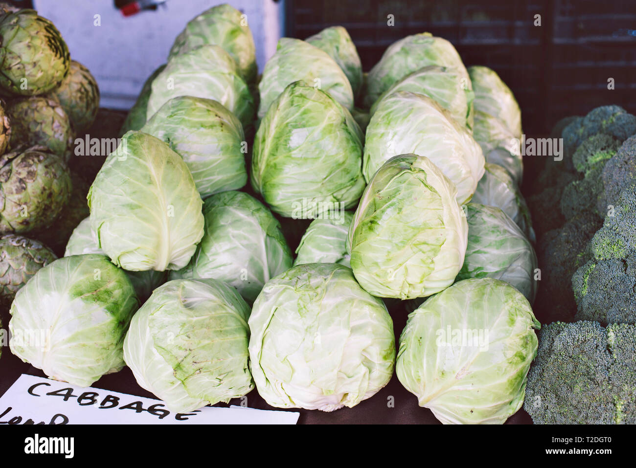 Selling cabbage at a market stall at the farmers market Stock Photo - Alamy
