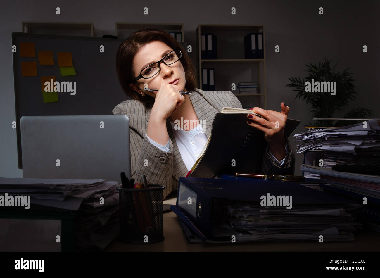 Female employee suffering from excessive work Stock Photo - Alamy