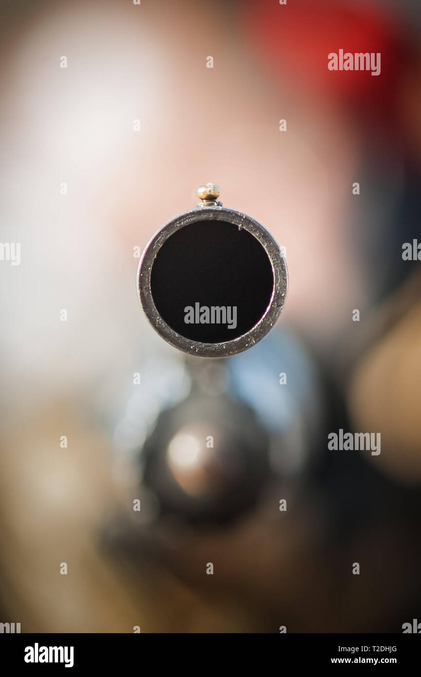 Direct macro detail close-up shotgun front view gun point. Firearm ...