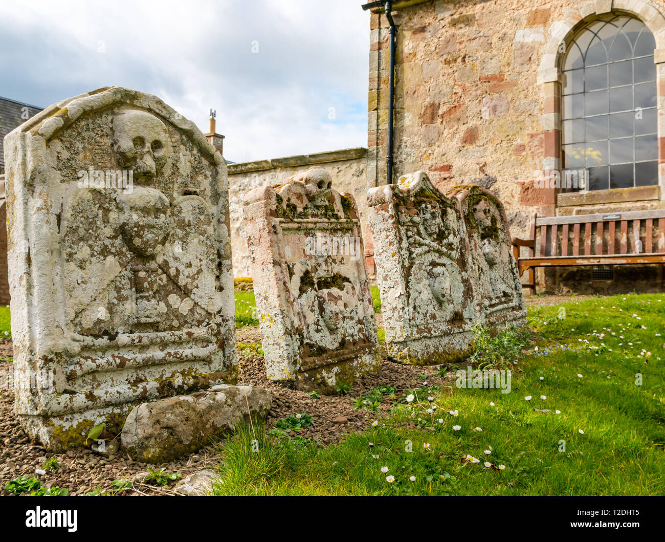 12th century Morham Parish Church and old gravestones with skull and ...