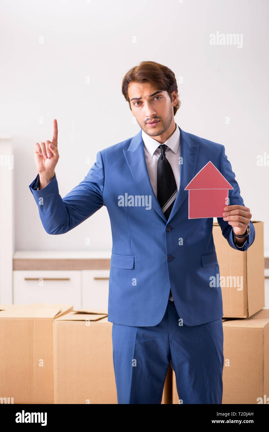Young handsome realtor selling flat Stock Photo - Alamy