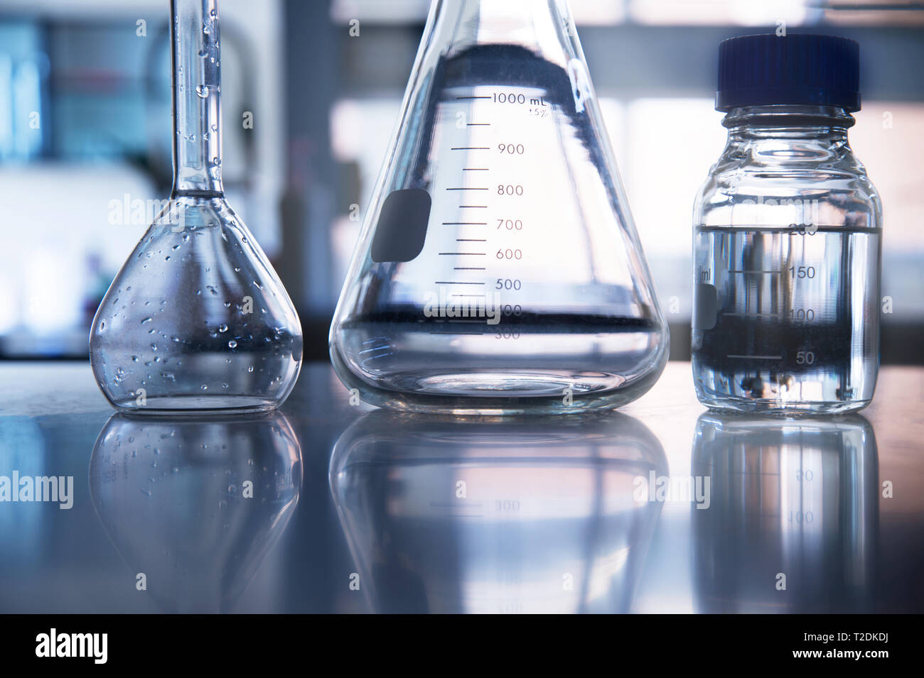 white clear flask and water in the bottle in medical science laboratory ...