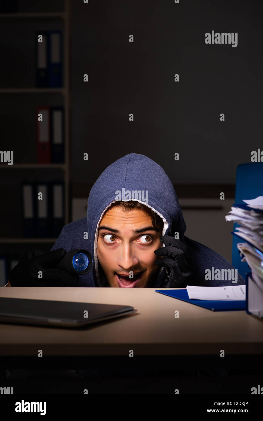 Thief trying to steal personal data in identity theft concept Stock ...