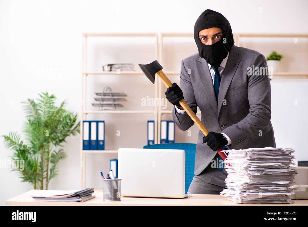 Male gangster stealing information from the office Stock Photo - Alamy