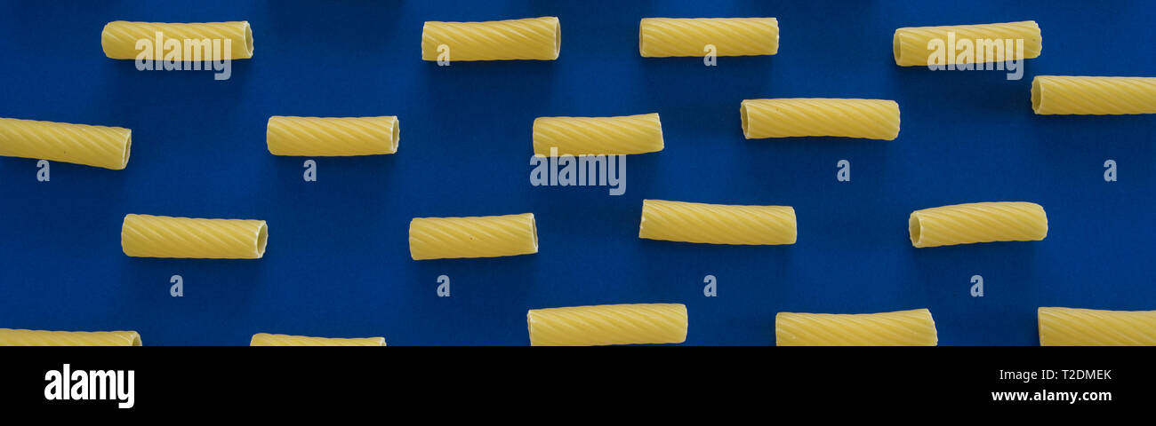 Abstract food background, Italian pasta products on blue background ...