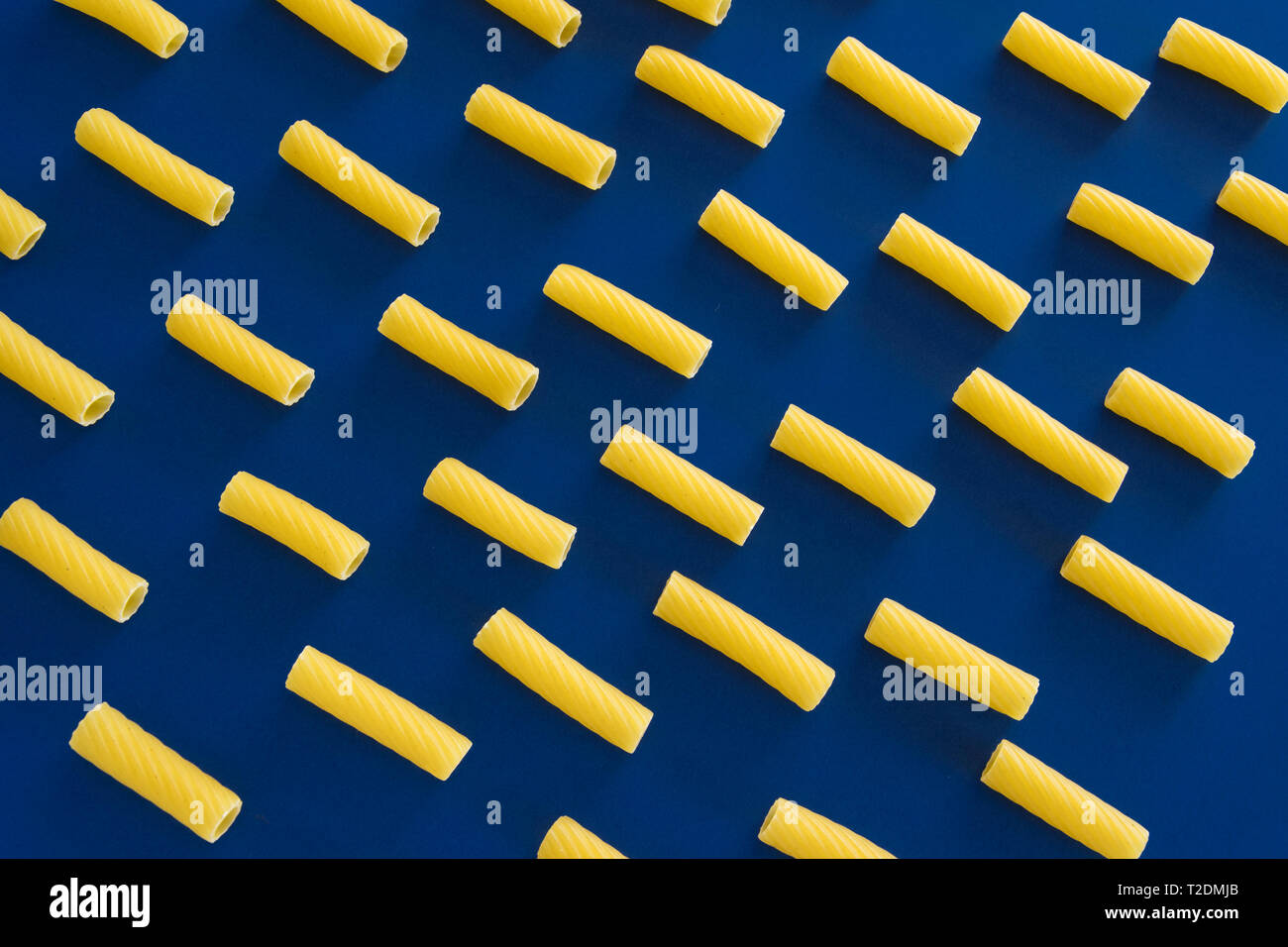 Abstract food background, Italian pasta products on blue background ...