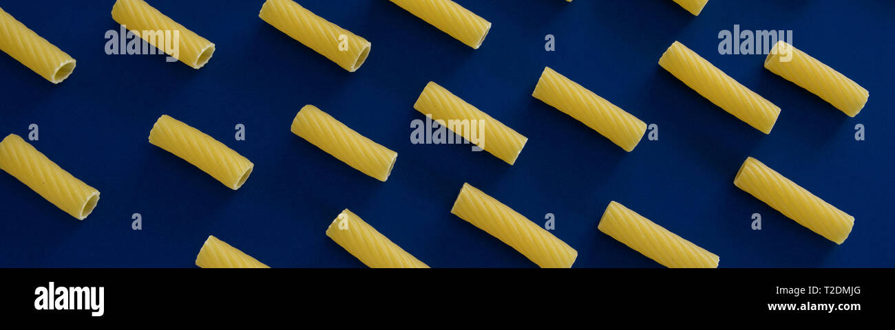 Abstract food background, Italian pasta products on blue background ...