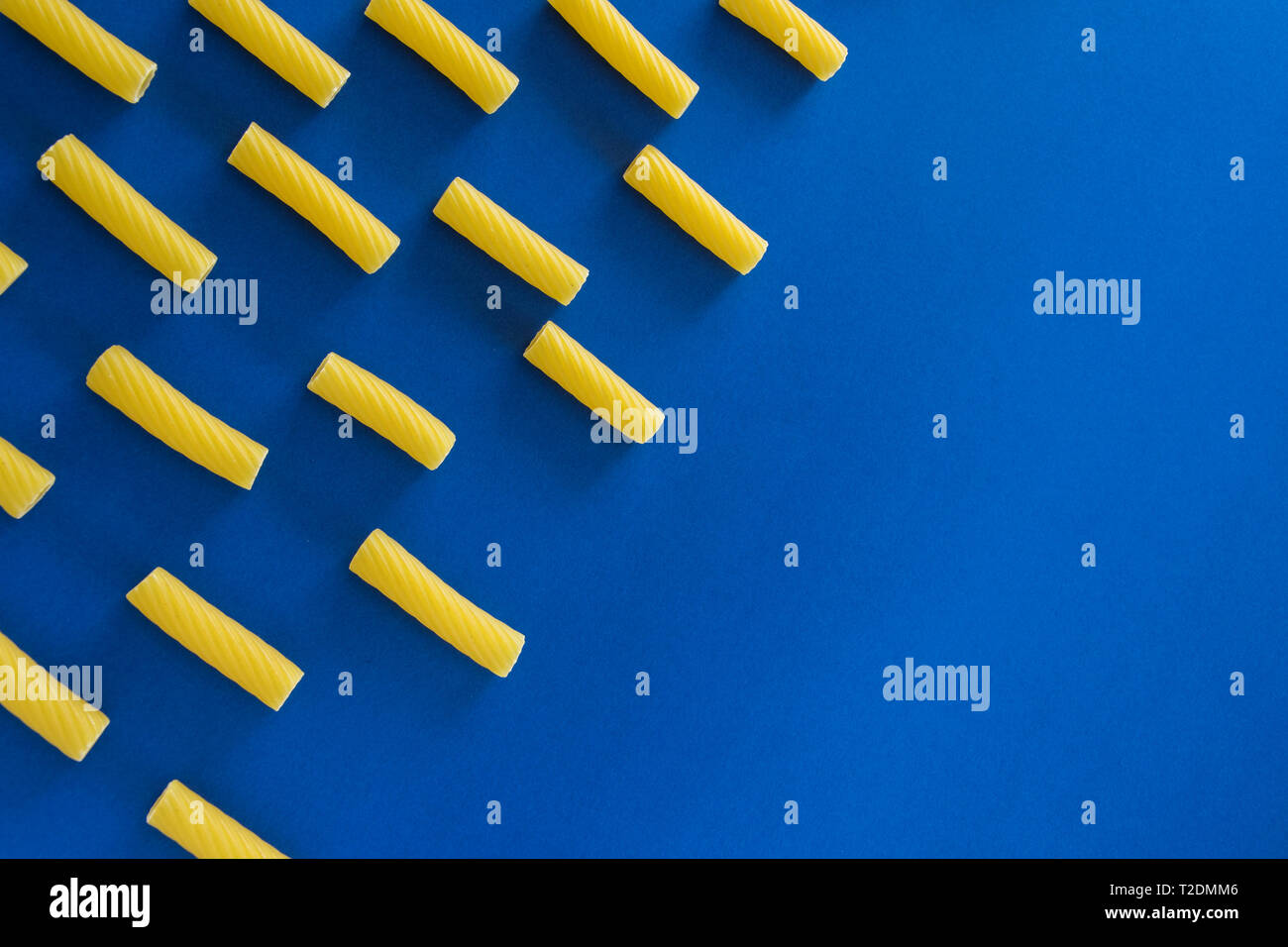 Abstract food background, Italian pasta products on blue background ...