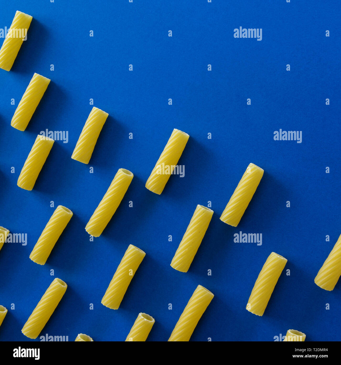 Abstract food background, Italian pasta products on blue background ...