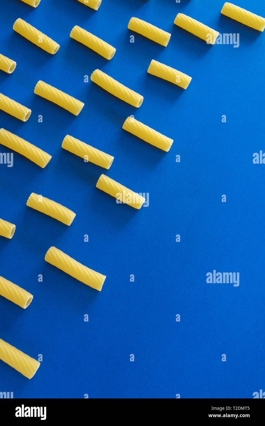 Abstract food background, Italian pasta products on blue background ...