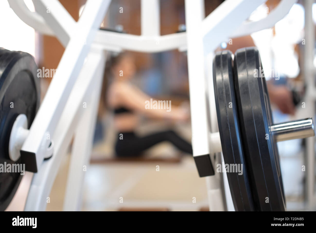 Crossfit equipment. Dumbbell and barbell weight plates on plate holder ...