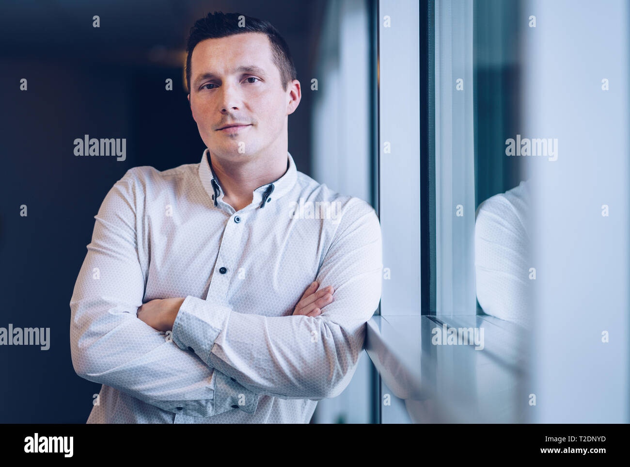 Portrait of a young confident professional in the office environment ...