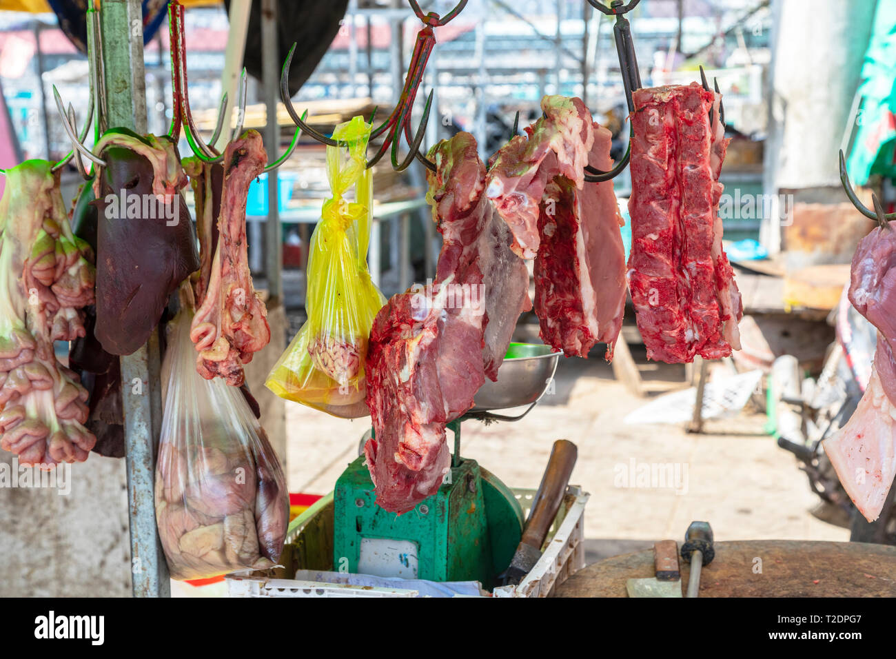 Butcher's stall with fresh meat and butchered animals, street market ...