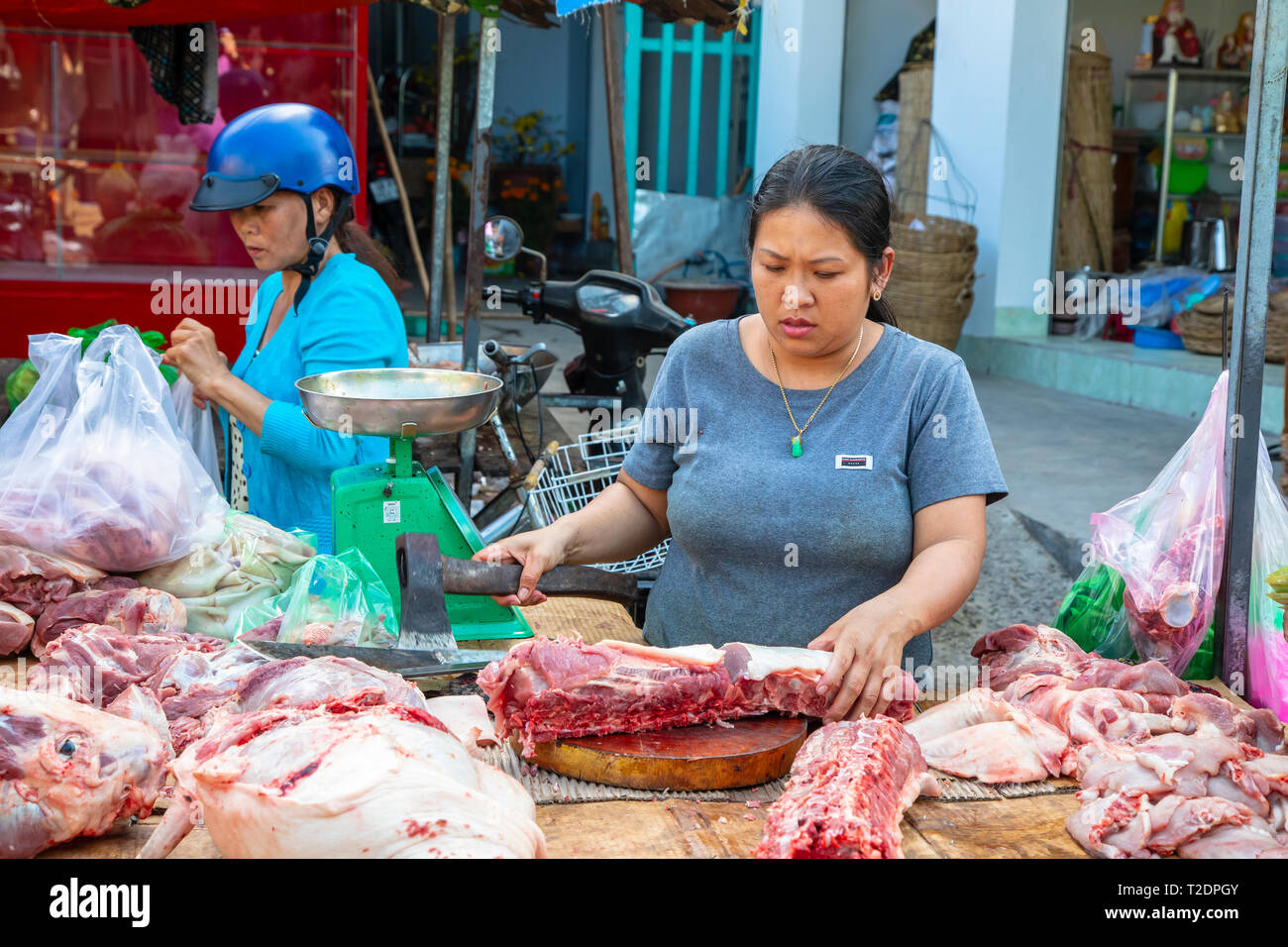 Butcher's stall with fresh meat and butchered animals, street market ...
