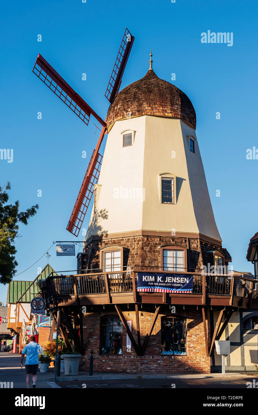 Side view of old style windmill architecture, small gift shop on ground ...