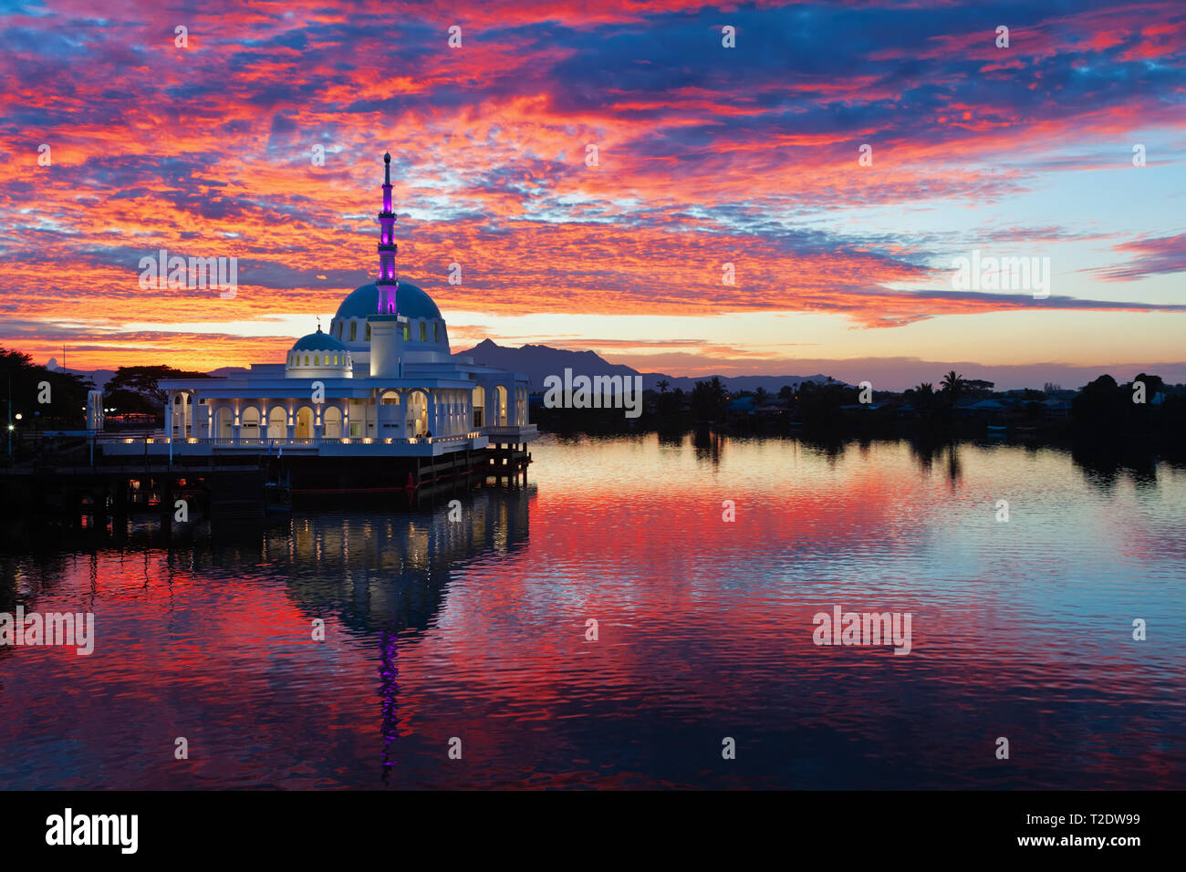 Scenic view of floating mosque on Sarawak river with colorful sunset ...