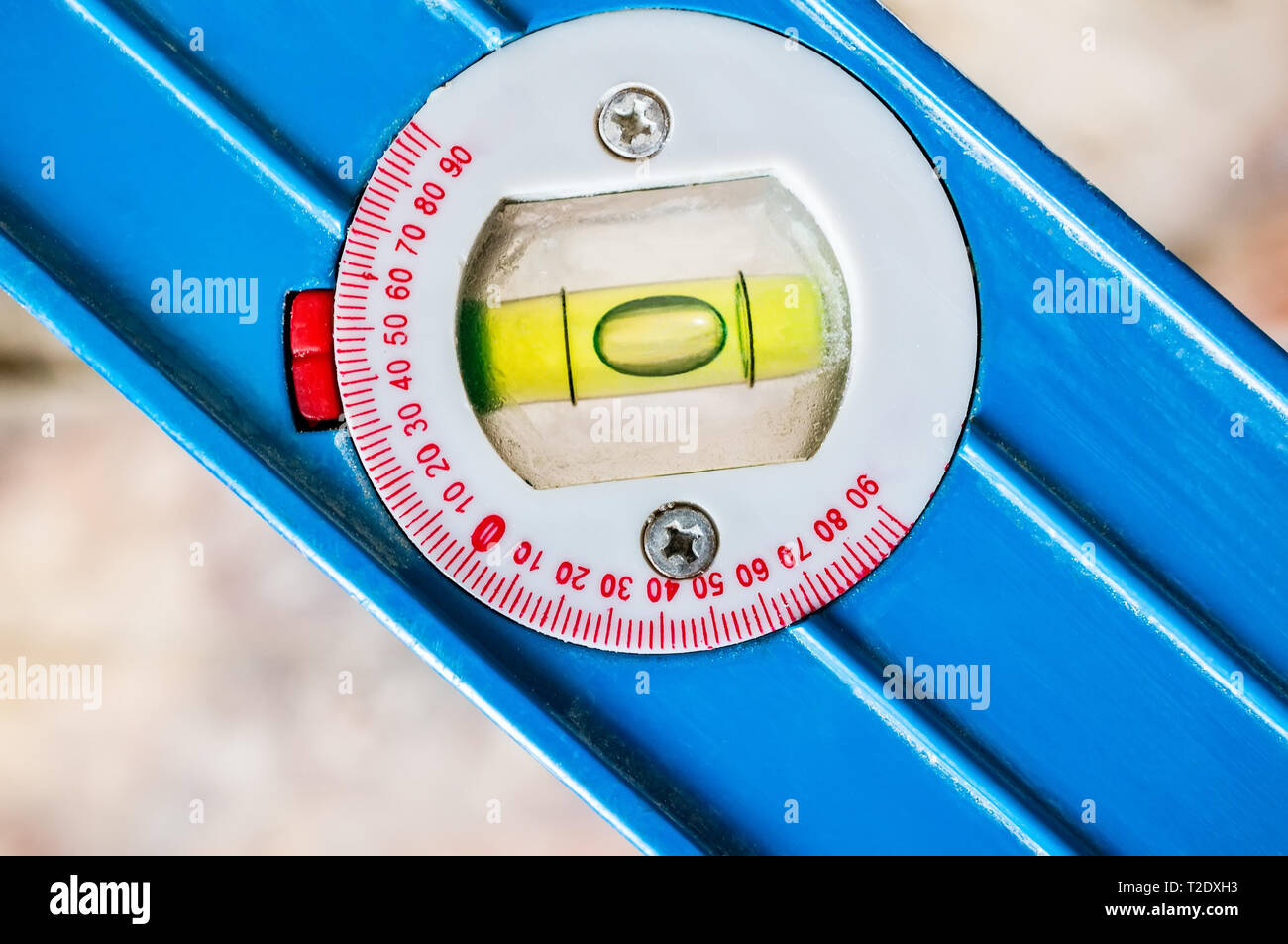 Yellow bubble level on blue background with clipping path. A tool for ...