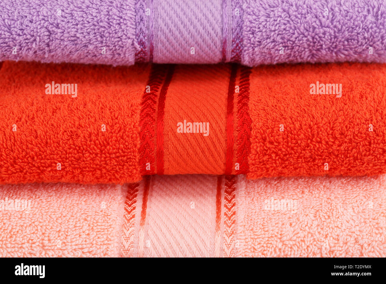 Colorful towels stack closeup picture Stock Photo - Alamy