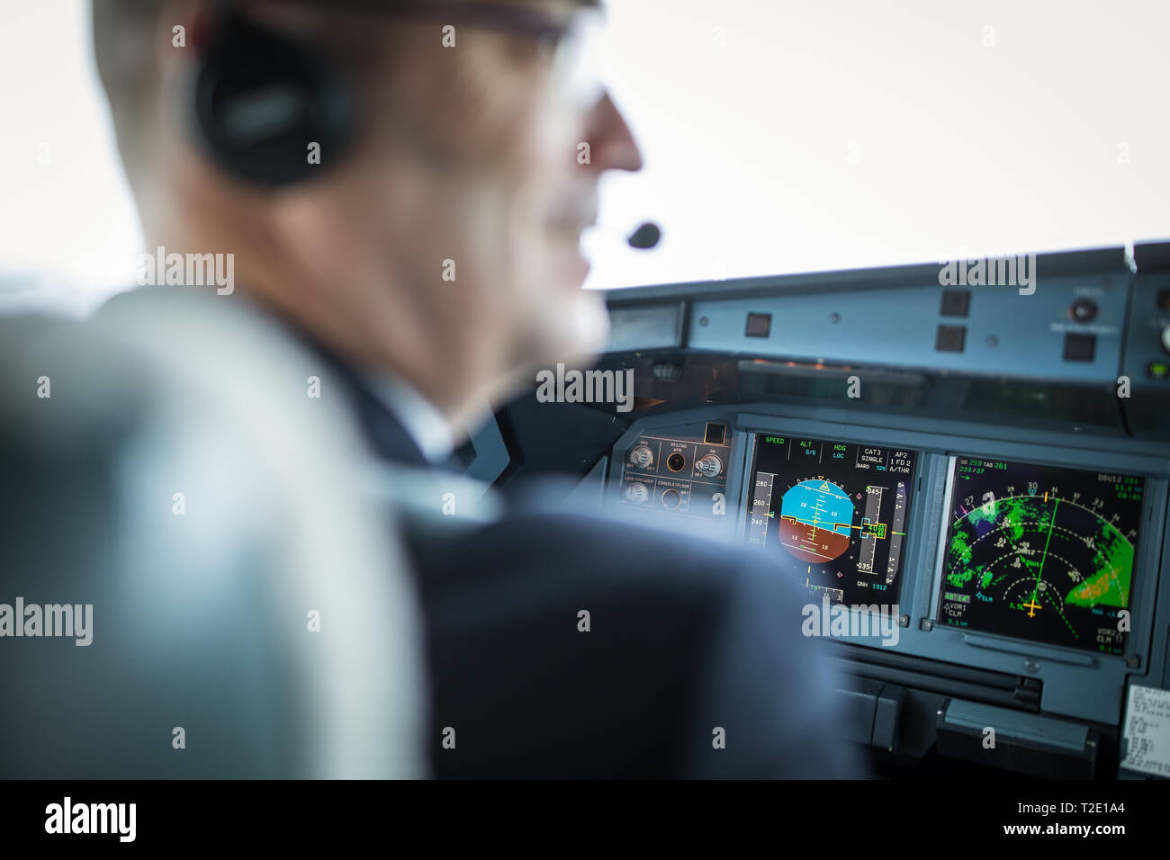 Pilot in a commercial airliner airplane flight cockpit during takeoff ...