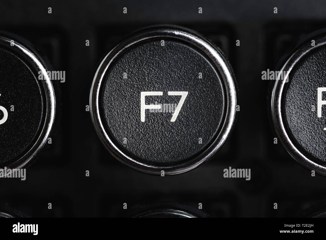 A macro or close-up shot of a retro style typewriter key cap keyboard ...