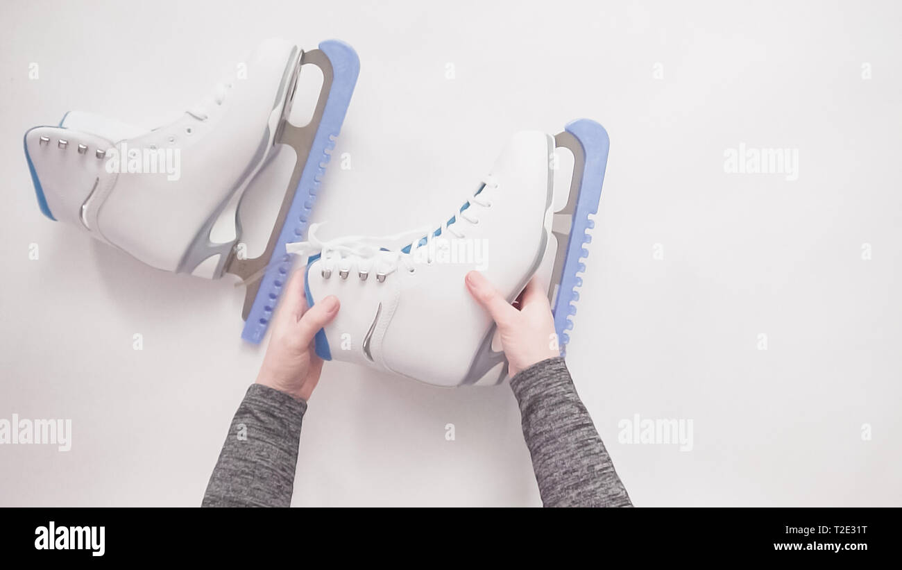 Flat lay. New figure skates on a white background Stock Photo - Alamy