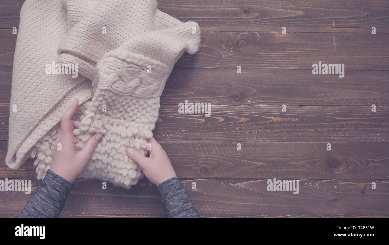 Flat lay. White wool scarf on a wooden boards Stock Photo - Alamy