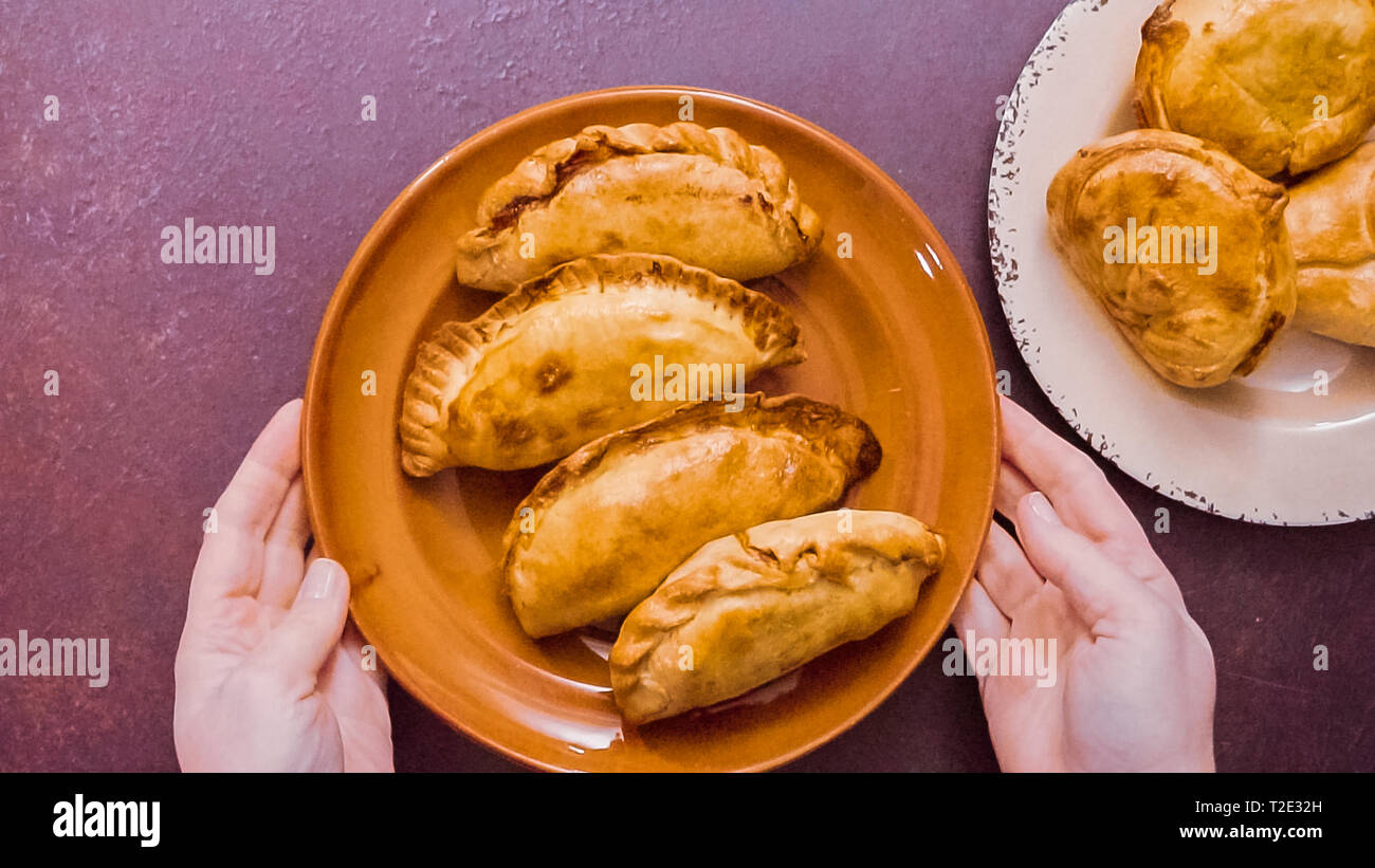 Flat lay. Homemade large empanadas with different staffings Stock Photo ...