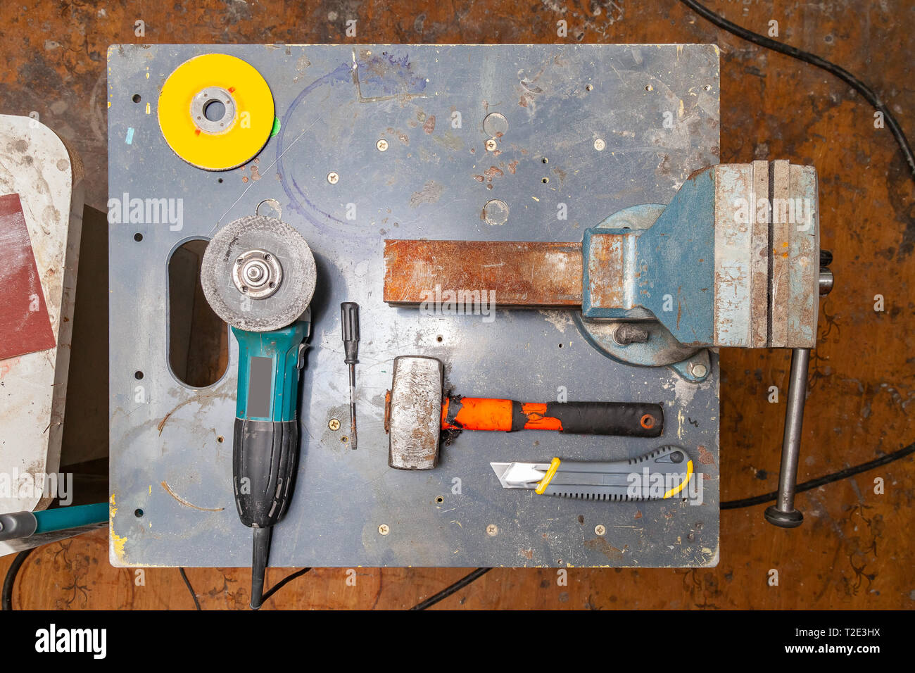 Flat lay view of a workbench with a set of tools consisting of a large ...