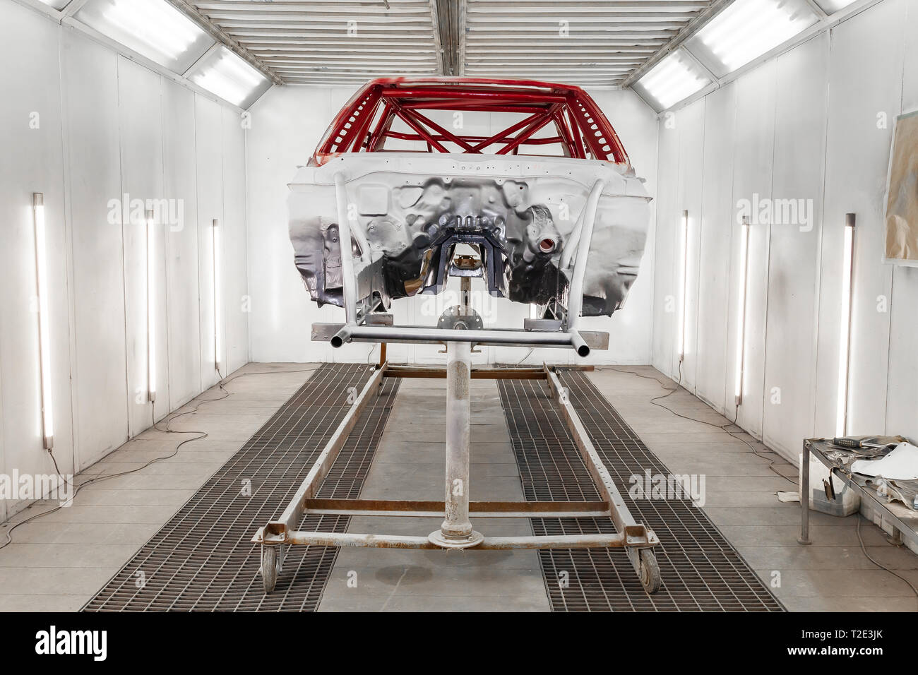 Painting in red and black color of the inside of the frame of the car ...