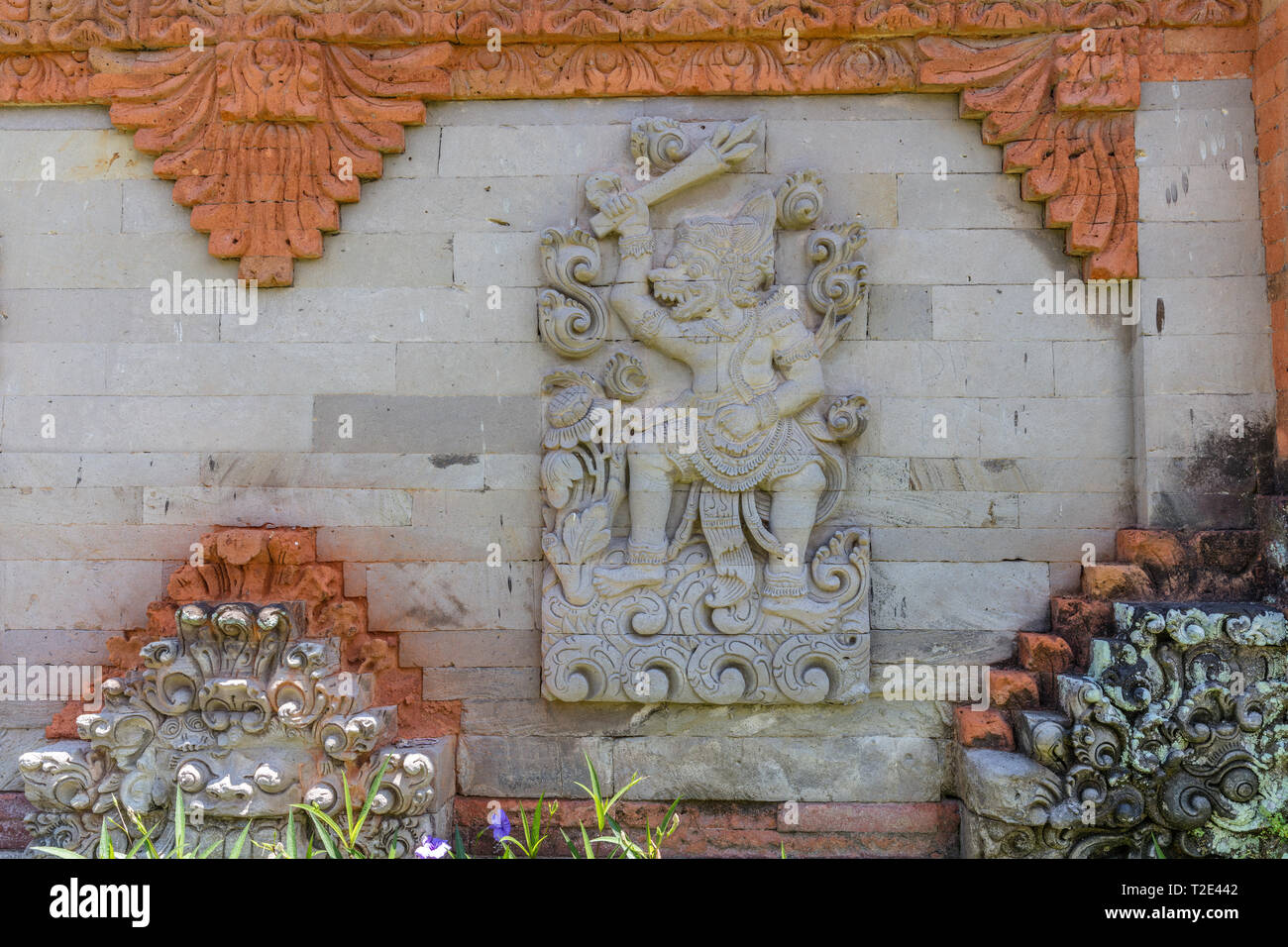 Stone carving on the wall. Traditional classic Balinese architecture ...