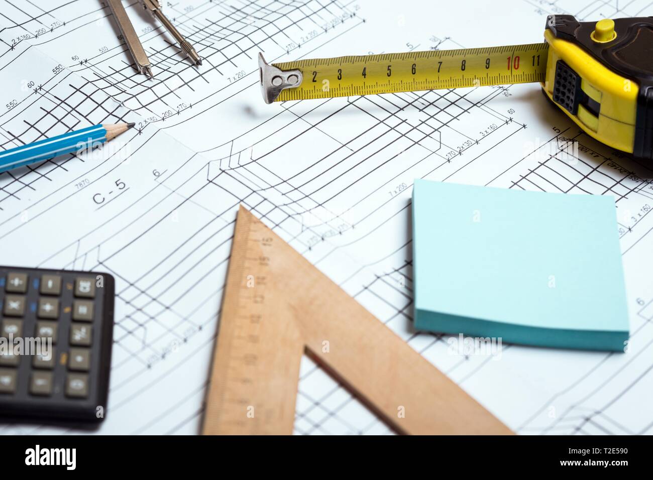 engineering and design. drawing and calculator, tape measure, ruler on ...