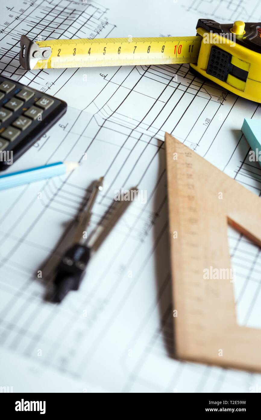engineering and design. drawing and calculator, tape measure, ruler on ...