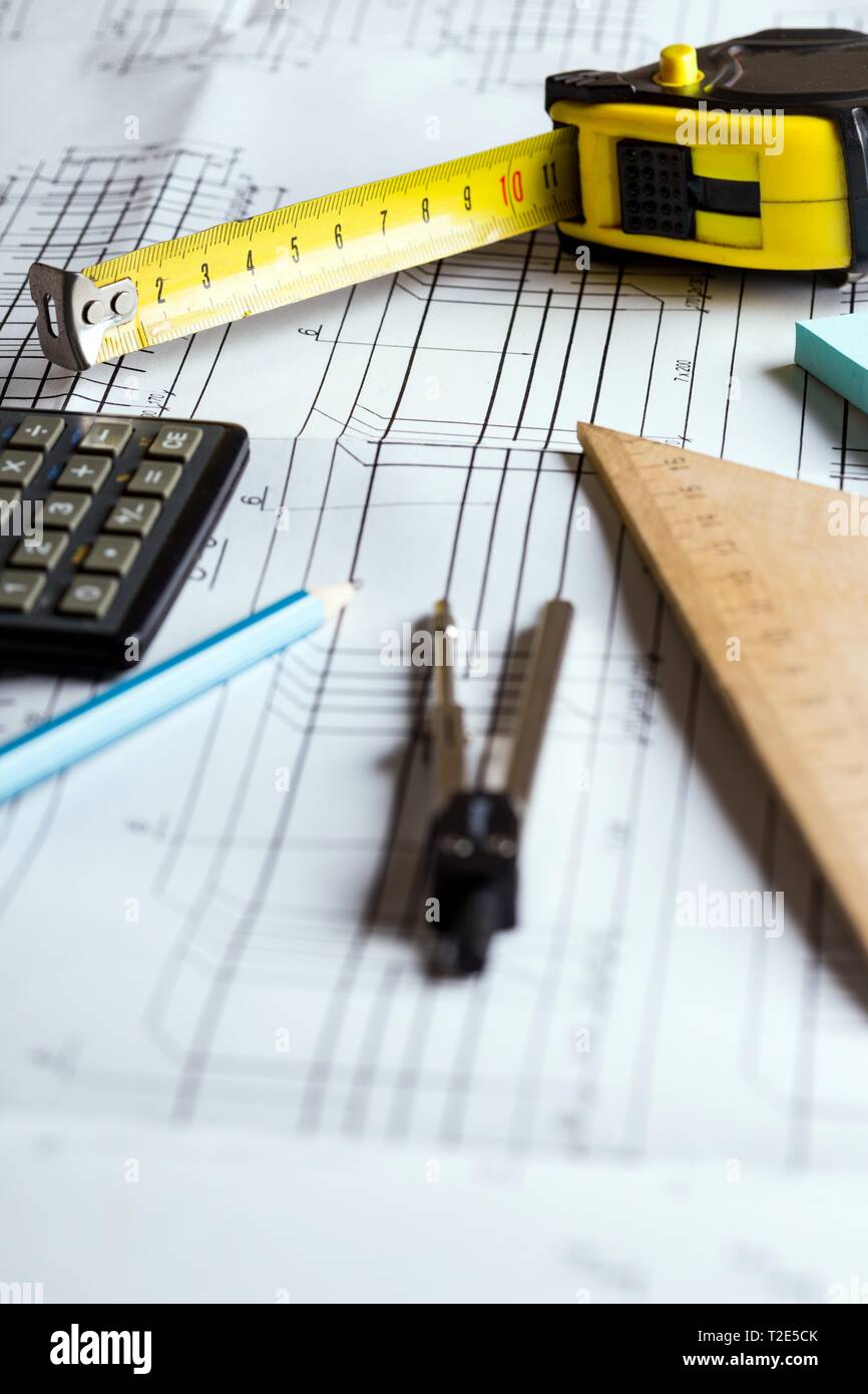 engineering and design. drawing and calculator, tape measure, ruler on ...