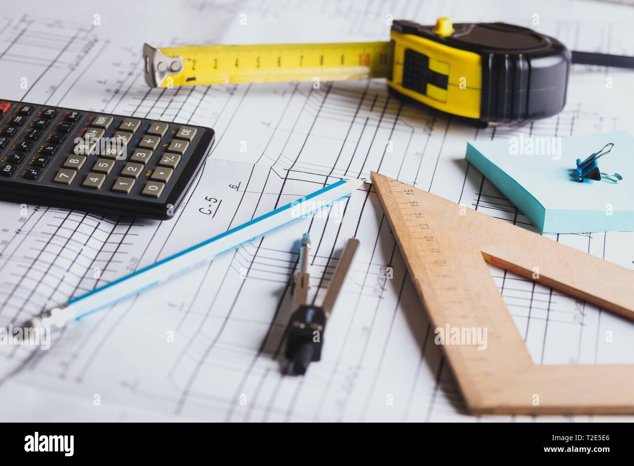 engineering and design. drawing and calculator, tape measure, ruler on ...