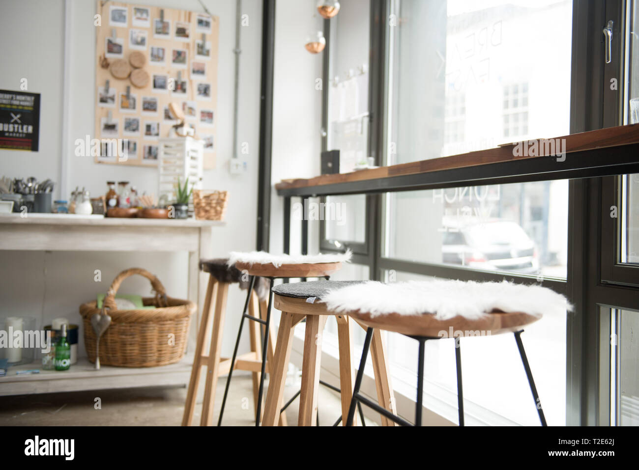 Hugge cafe bar stools next to window Stock Photo - Alamy