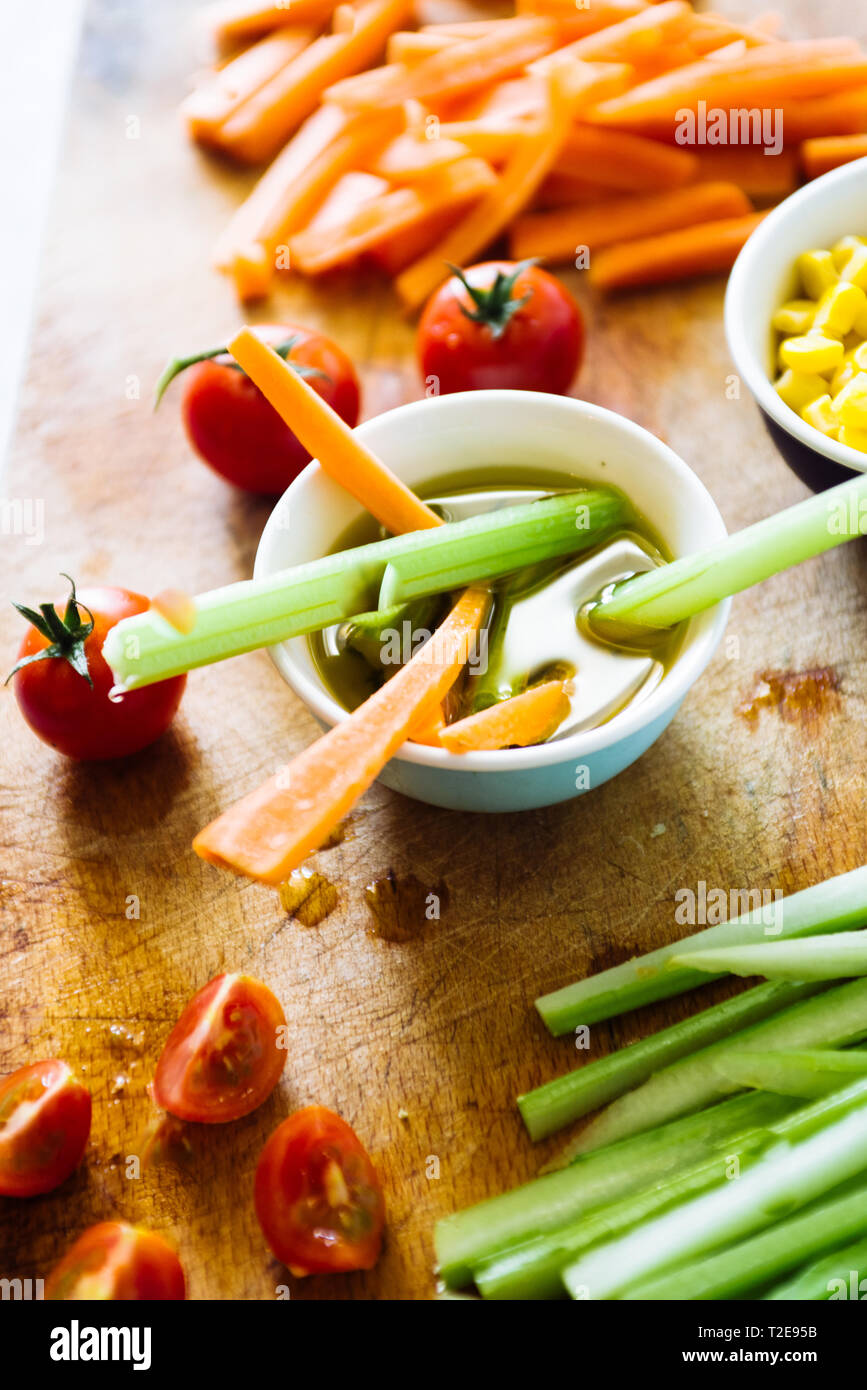 Typical italian "pinzimonio", vegetables carrots celery dipped in olive ...