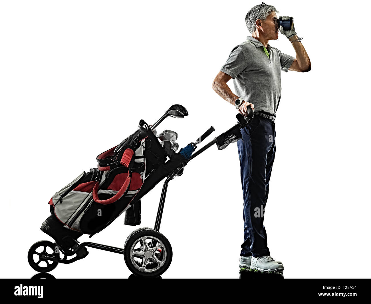 one caucasian senior man golfer golfing in studio shadow silhouette ...