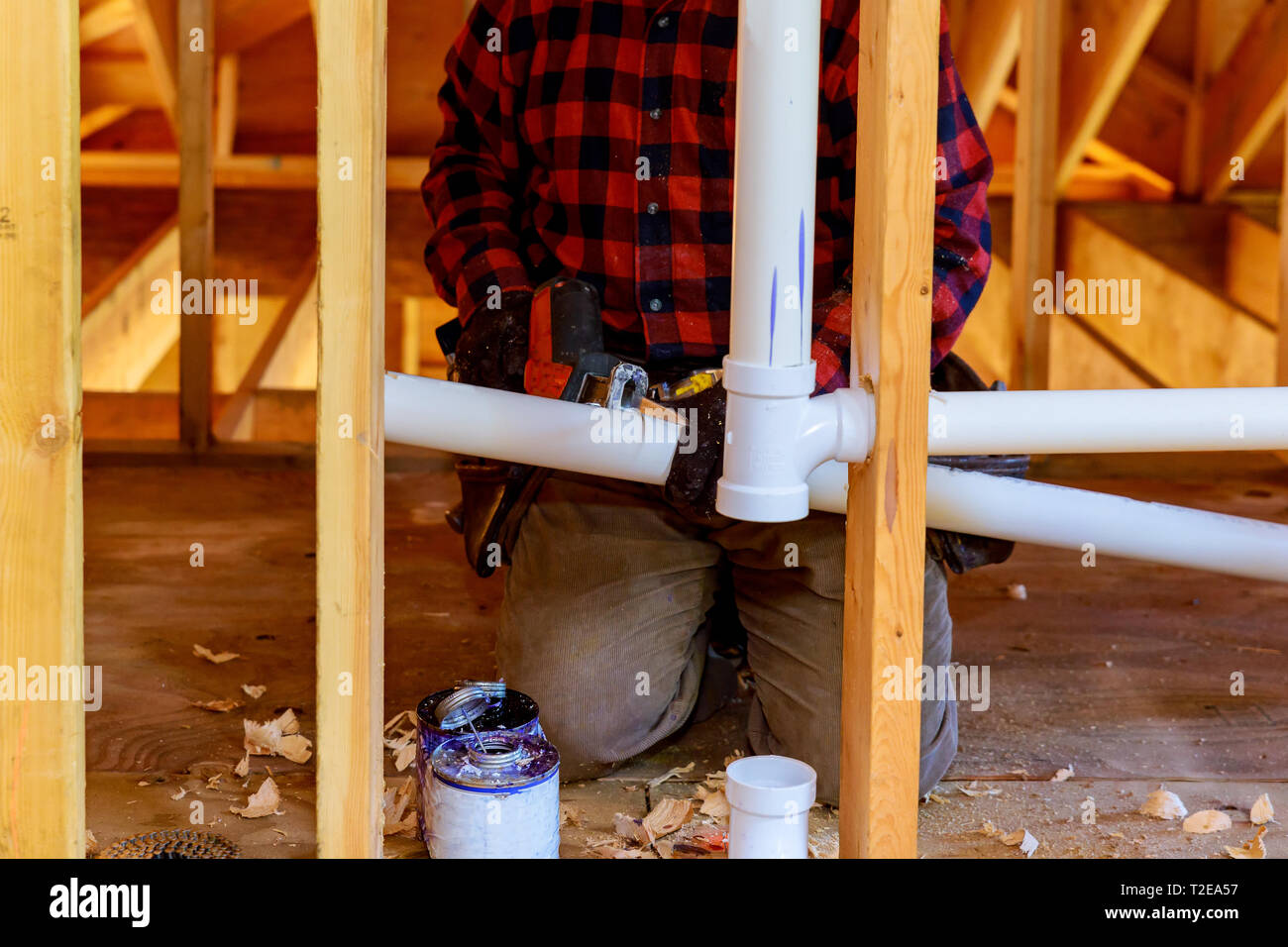 contractor installing a drainage system for a wall at a new commercial ...