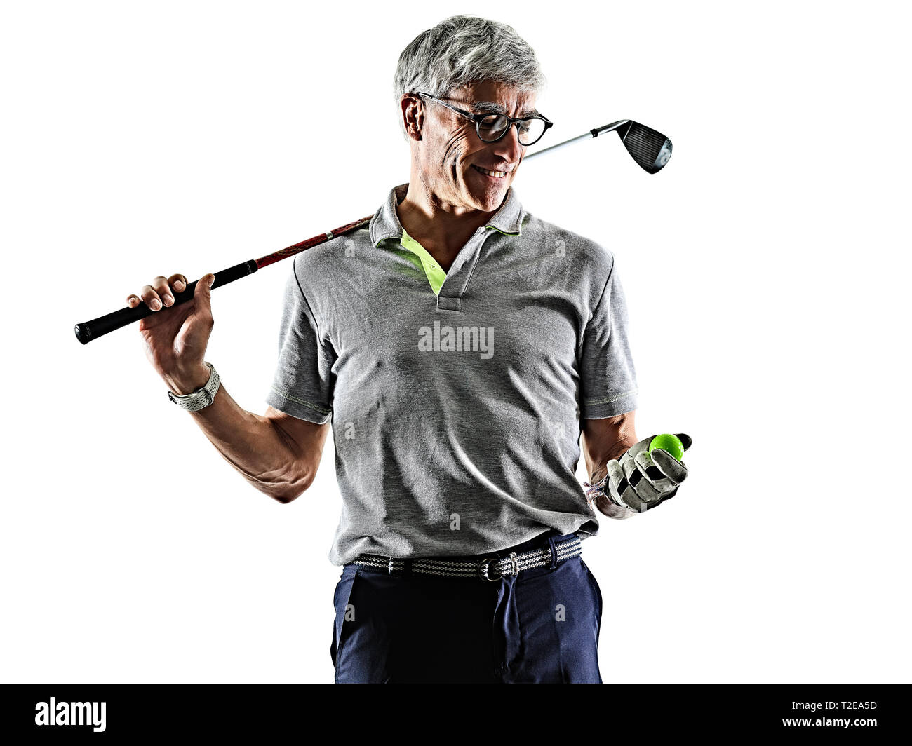 one caucasian senior man golfer golfing in studio shadow silhouette ...