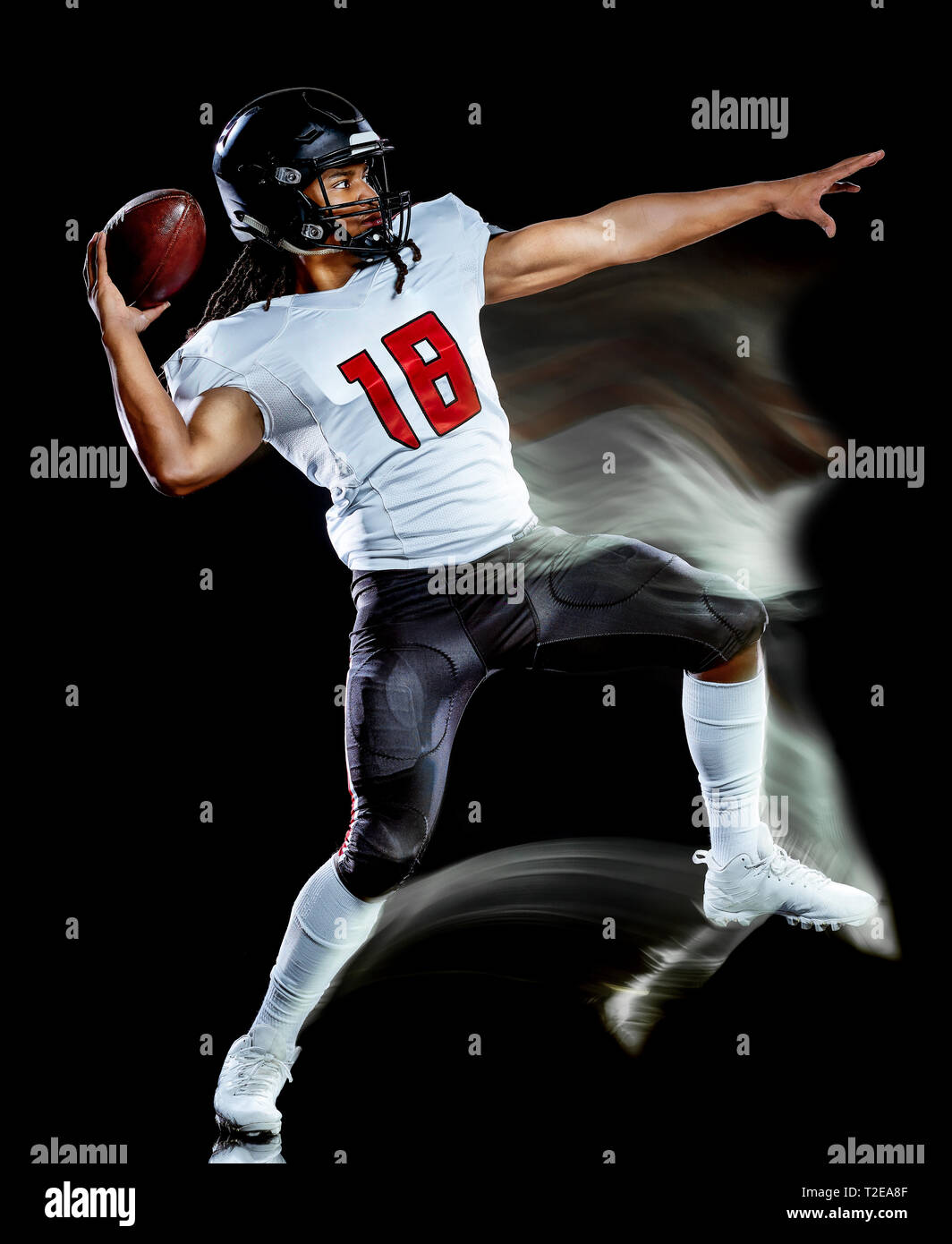 one african american football player man studio shot isolated on black ...