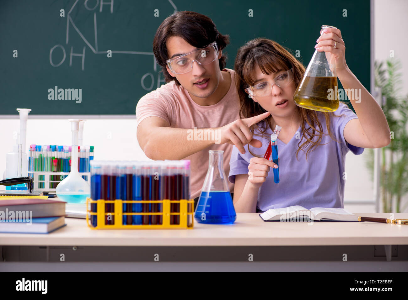Two chemists students in classroom Stock Photo - Alamy