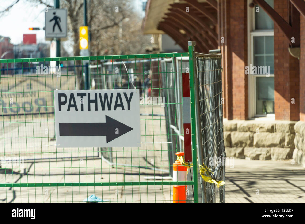 Sign showing temporary pathway during building renovation on city ...