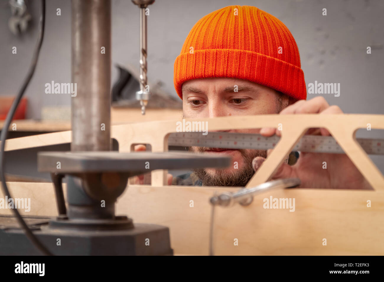 Profesional drilling wood on vertical drill machine. Close up of a ...