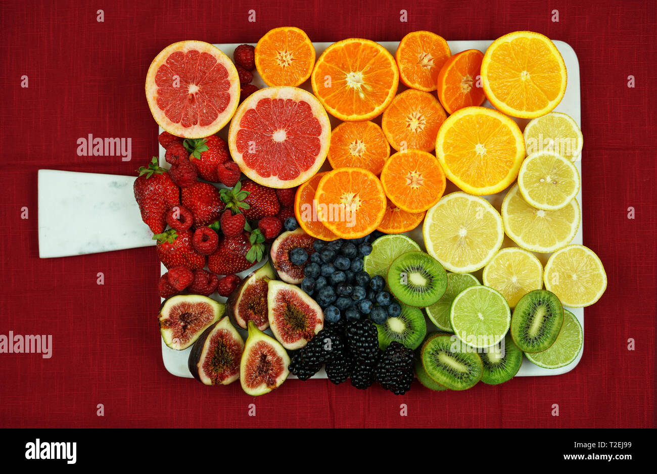 Colorful fruit platter assembly with rainbow color fruit including ...